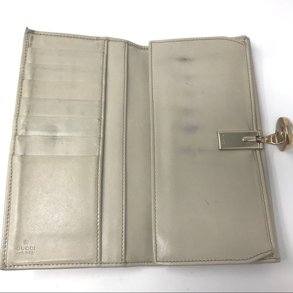 Gucci | Bags | Gucci Ivory Leather Gg Wallet With Gold Flip Lock | Poshmark